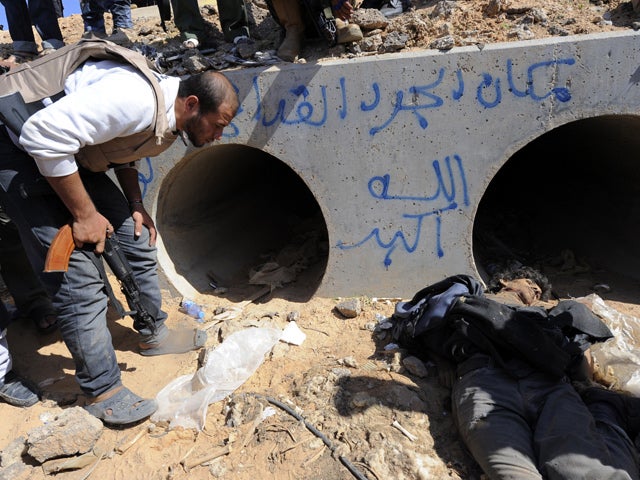 The death of Muammar Qaddafi - CBS News