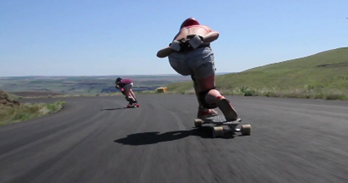 Freeriding longboards downhill at extreme speeds - CBS News
