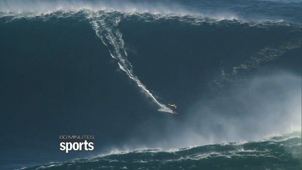 How an extreme waterman conquered a wave and surfed into history - CBS News