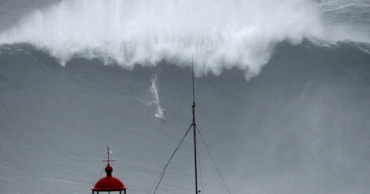 Surfer may have new world record on giant wave in Portugal - CBS News
