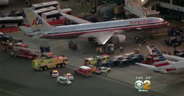 Fuel truck hits plane at LAX, injuring 1 person - CBS News