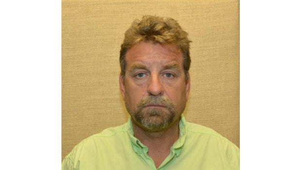 Man charged after wife's body found in burning home - CBS News