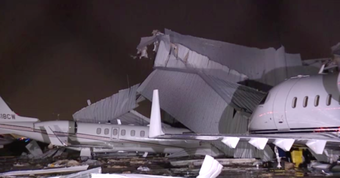 Airport hangar collapses during strong storm in Houston, crushing ...