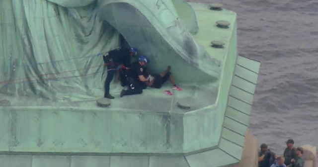 Liberty Island shut down after protester climbs Statue of Liberty - CBS ...