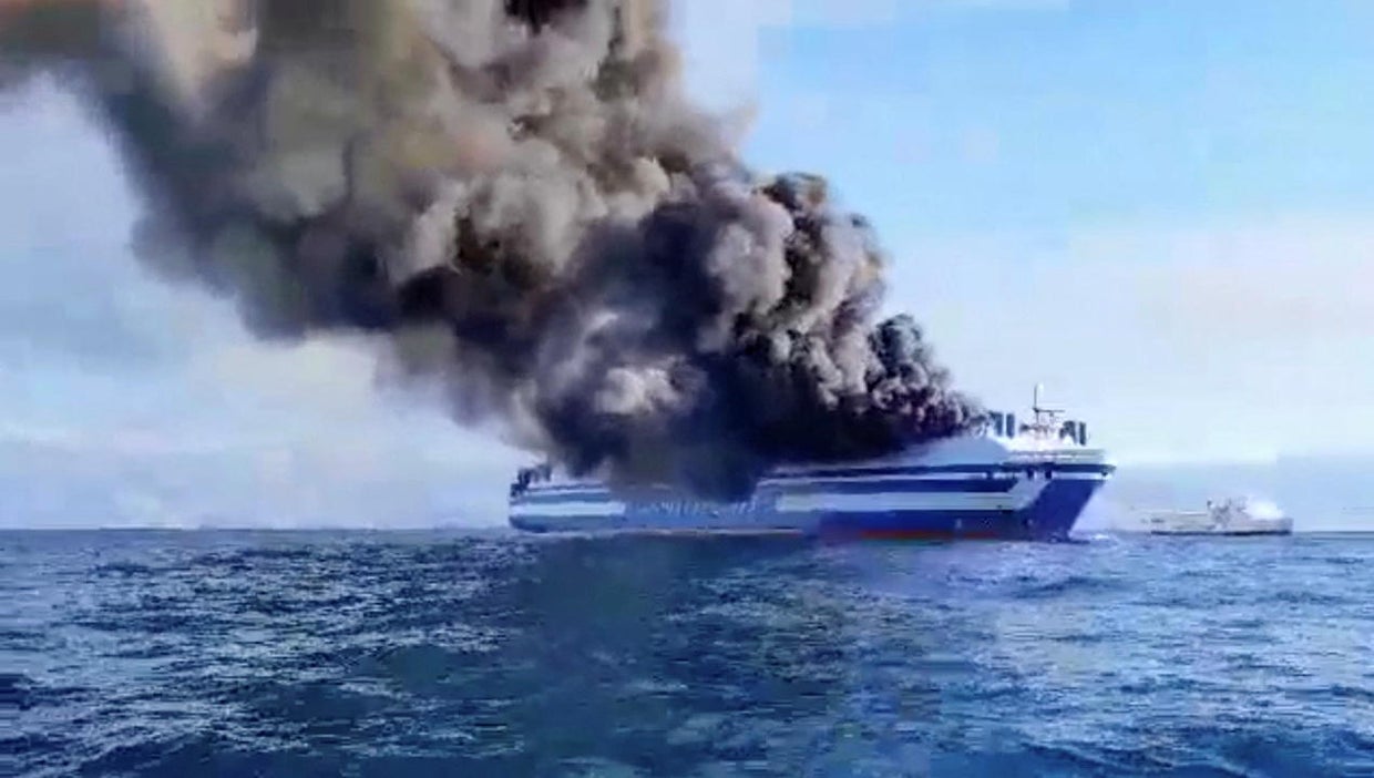 Rescuers search for 12 missing people as ferry burns off the coast of ...